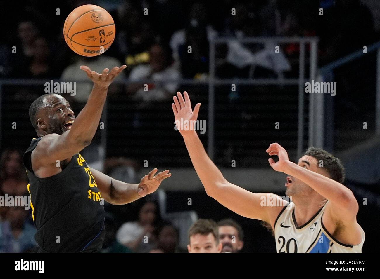 Golden State Warriors forward Draymond Green (23) and Atlanta Hawks forward Georges Niang (20 ...