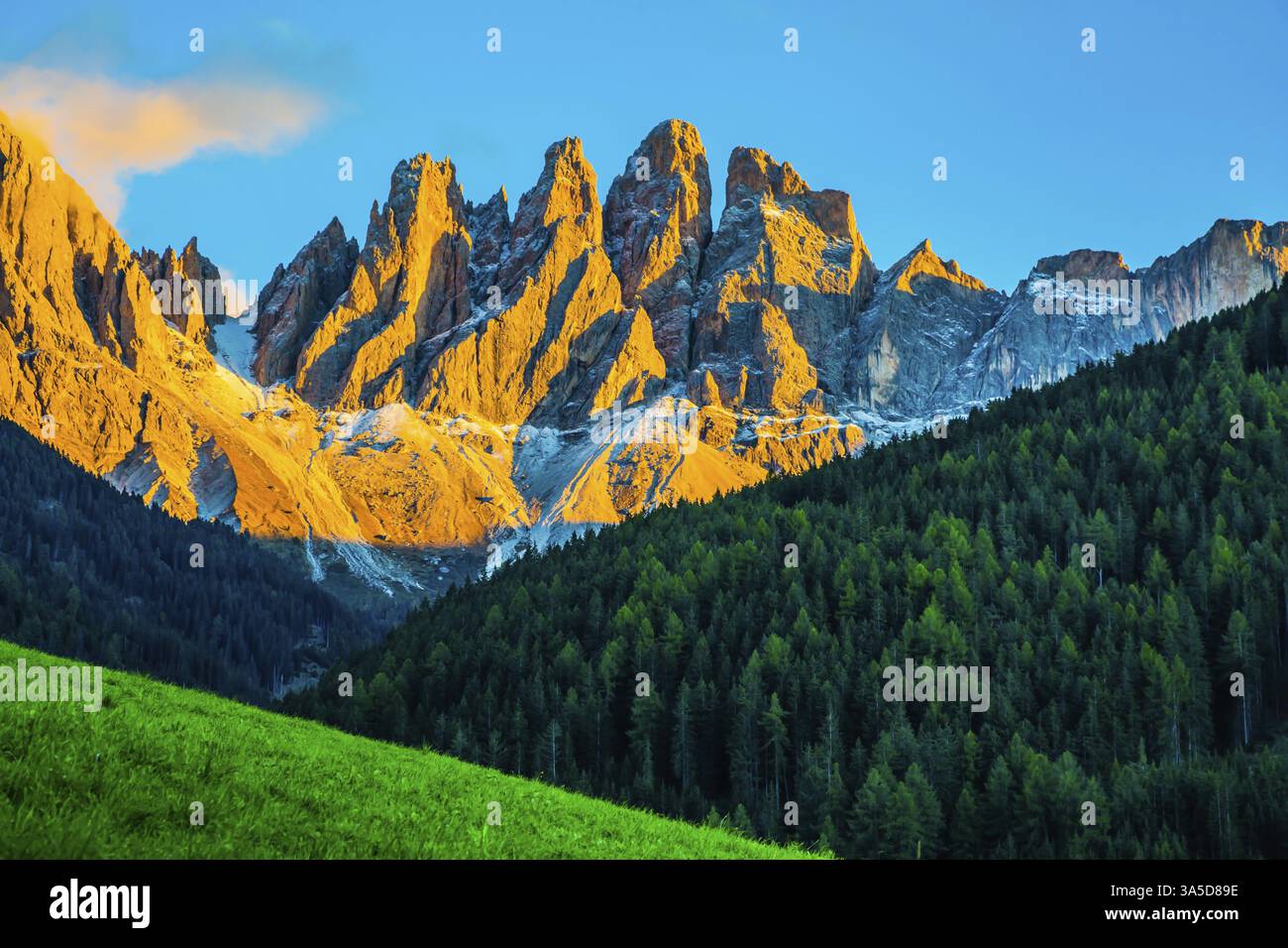 The Dolomites. Magnificent serrated cliffs illuminate the summer sunset ...