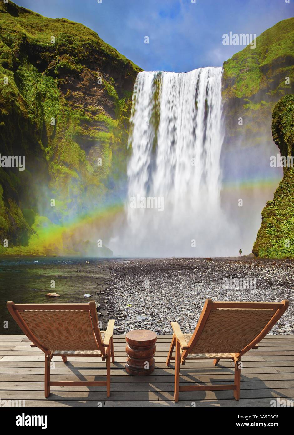 Magnificent powerful jet Skogar River forms a large rainbow. The famous ...