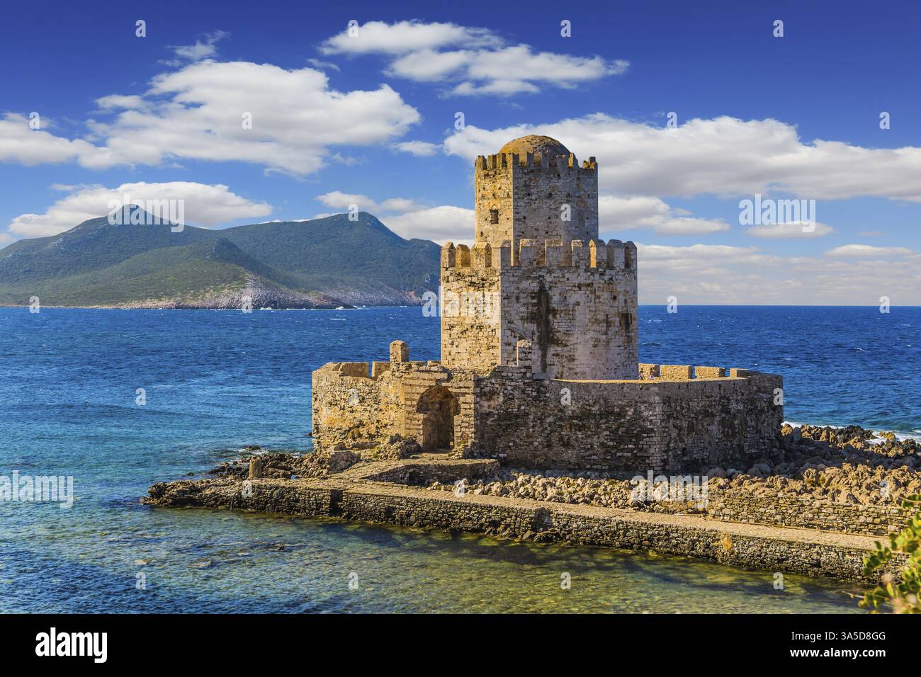 Magnificent three-tiered watchtower built on long cape in the sea ...