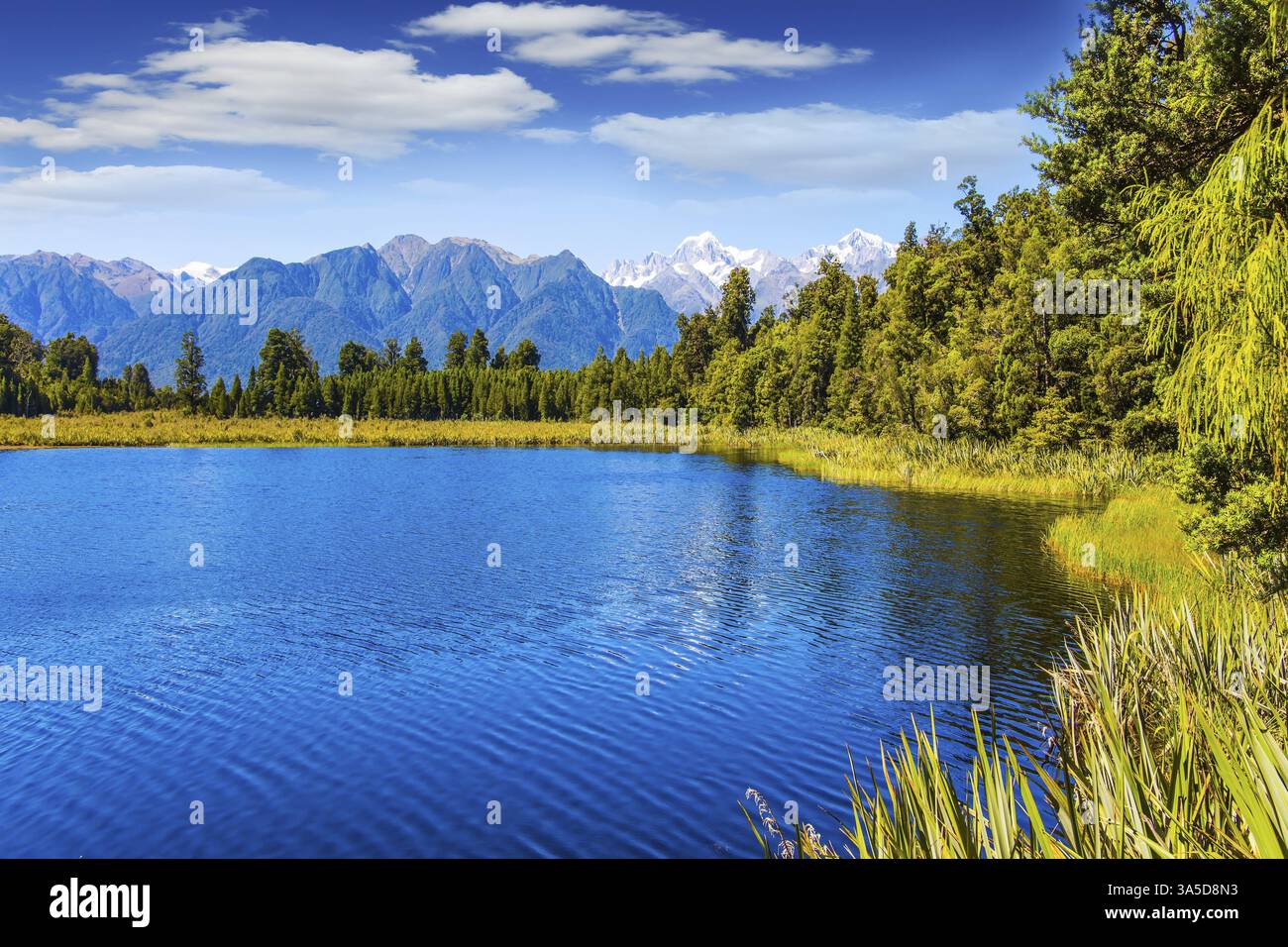 Lake Matheson is a beautiful and picturesque glacial lake in the South ...