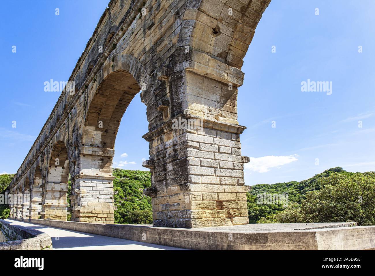The perfectly preserved arch of the aqueduct. The Pont du Gard is the ...