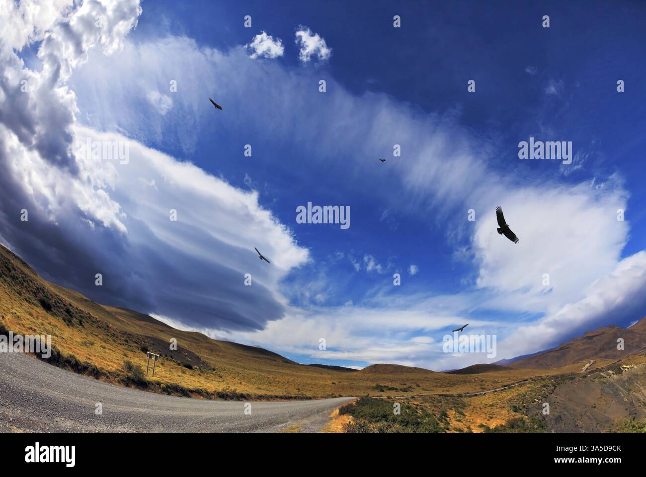 Journey into a far country. Gravel road, incredible forms clouds and ...