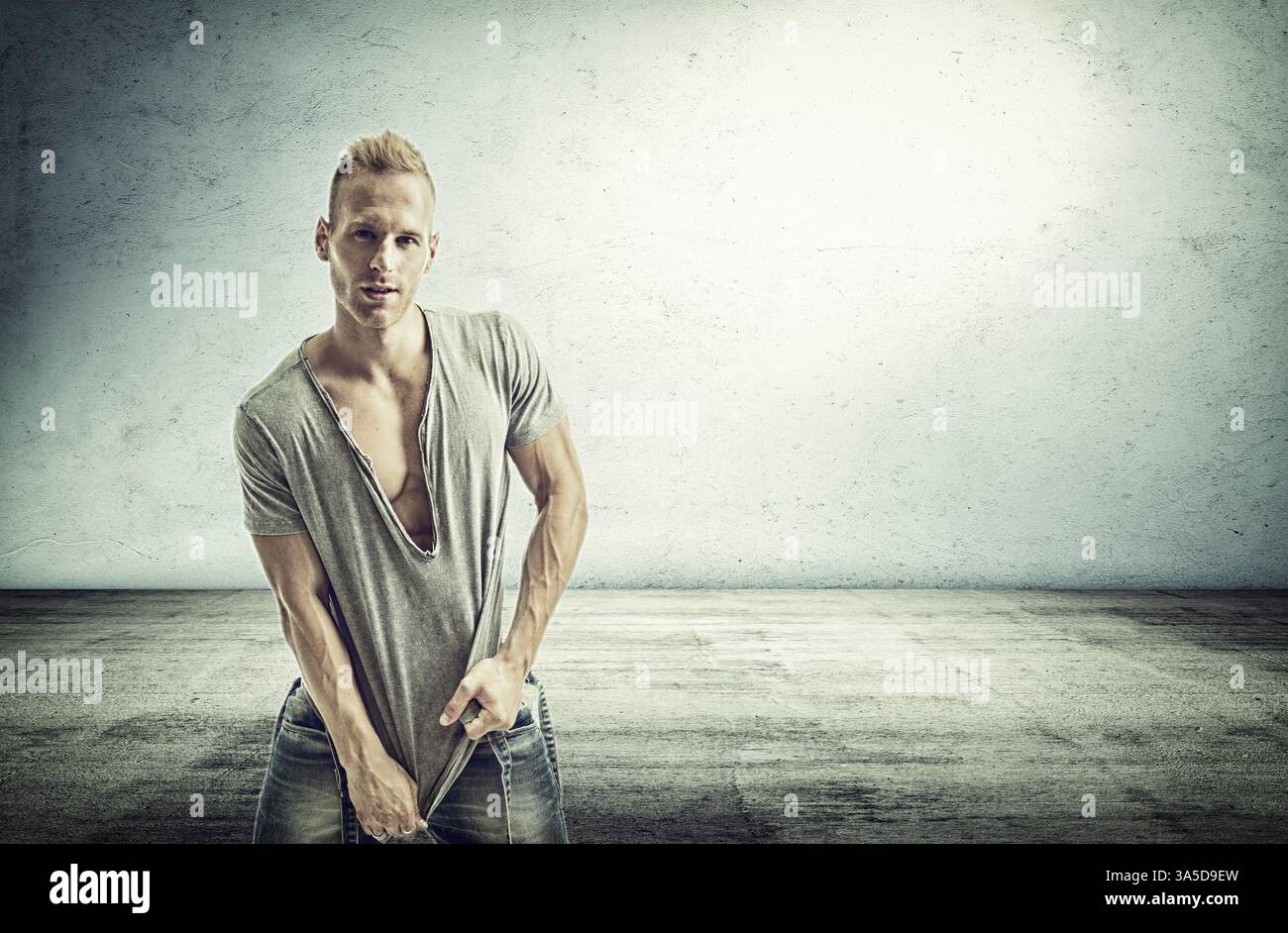 Muscular male model smiling, posing with a lot of confidence, in ...