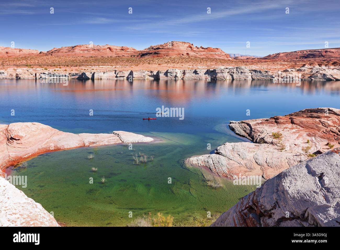Lake Powell. The water reflects the surrounding shores. The smooth ...