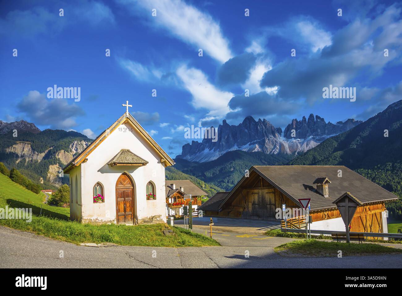 Magnificent serrated cliffs and small chapel in the Dolomites ...