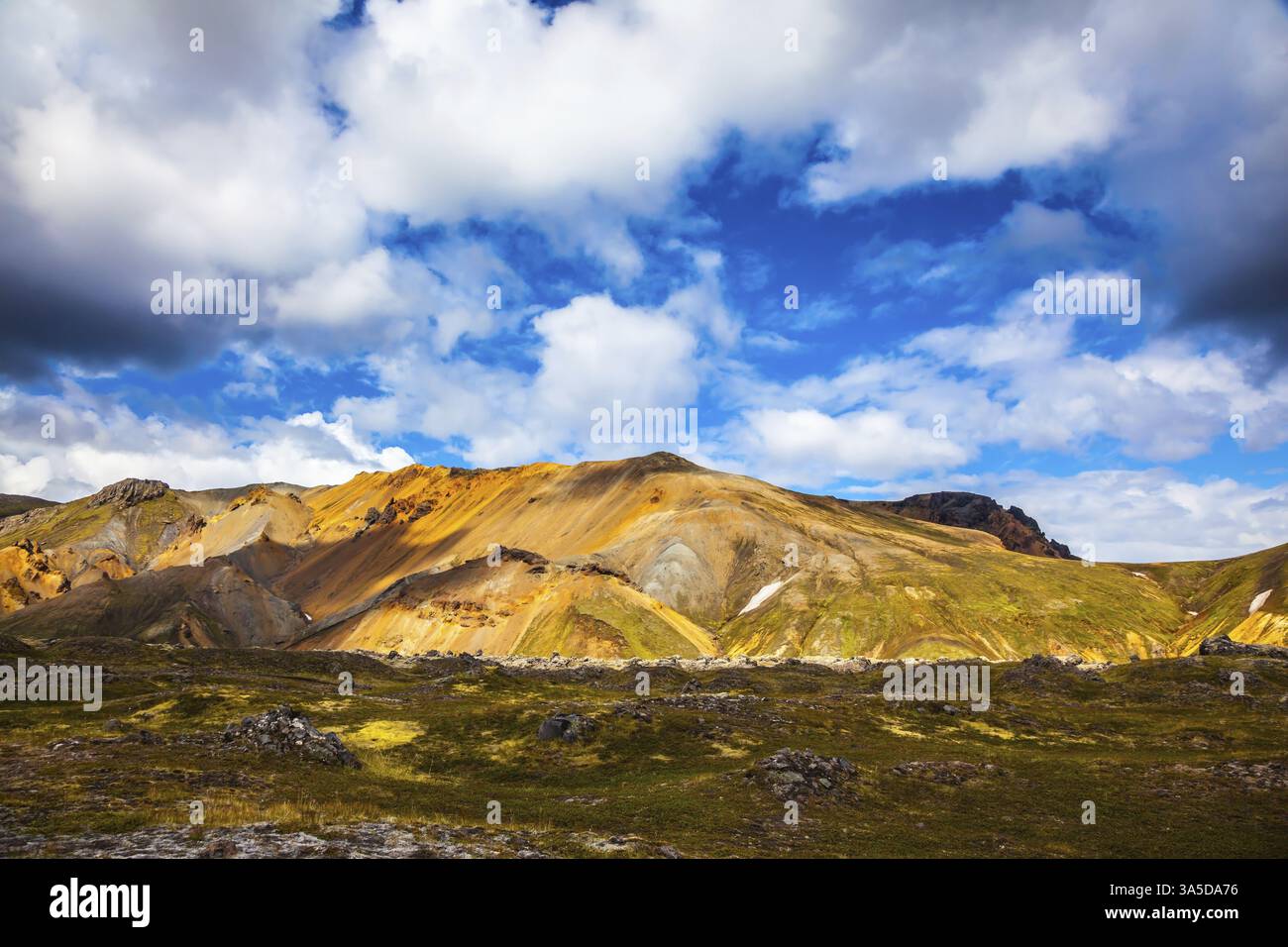 Multi-colored rhyolite mountains - orange, yellow, green and blue ...