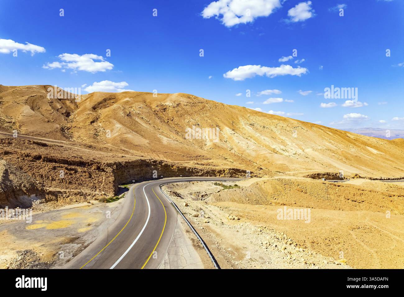 Desert on the shores of the Dead Sea. Israel. Asphalt highway meanders ...