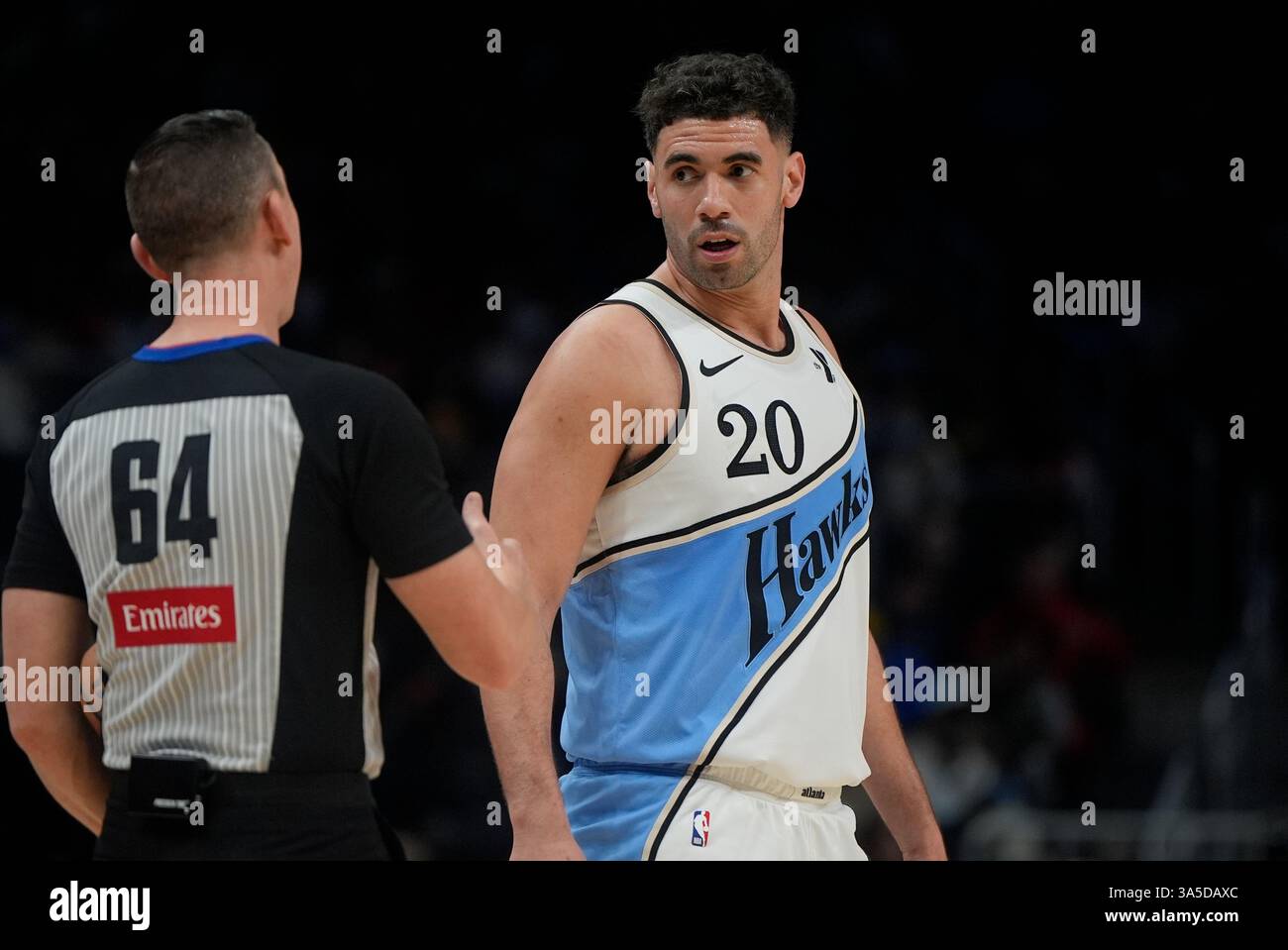 Atlanta Hawks forward Georges Niang (20) speaks with referee Justin Van Duyne (64) during the ...