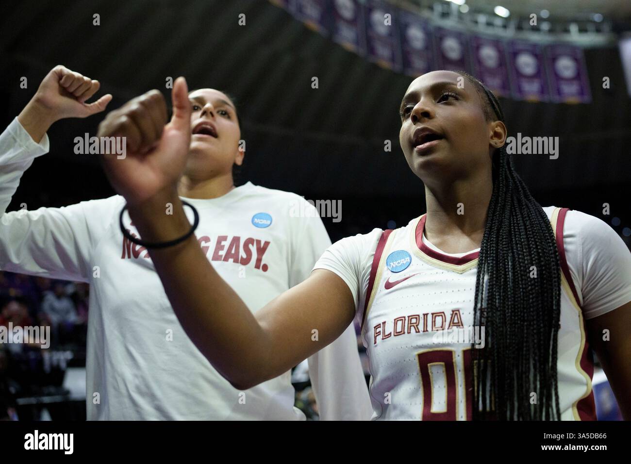 Florida State guard Ta'Niya Latson (00) and her team react after a game ...