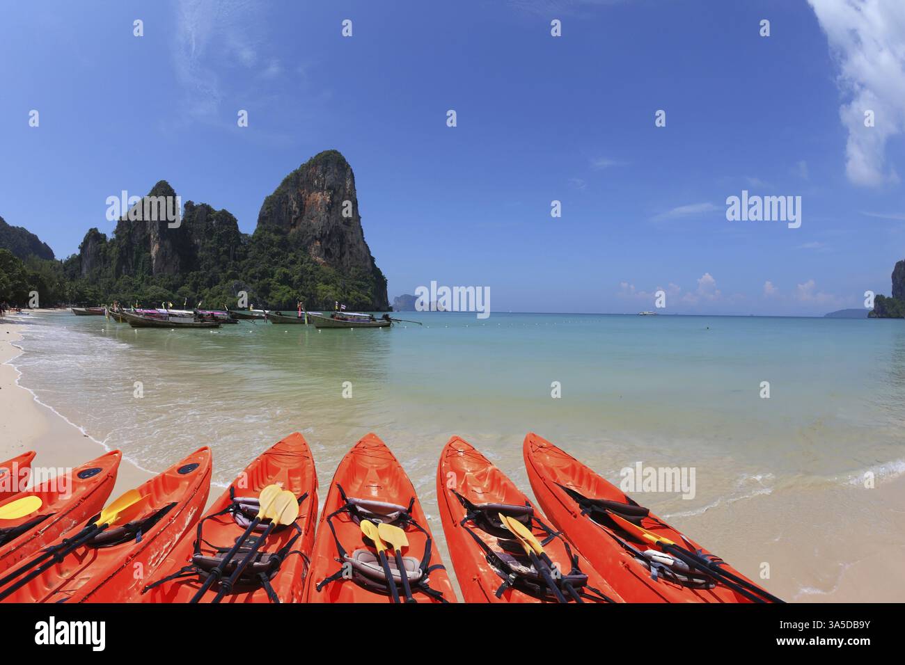 Red modern boats - canoes and boats antique Longtail on a beach in ...