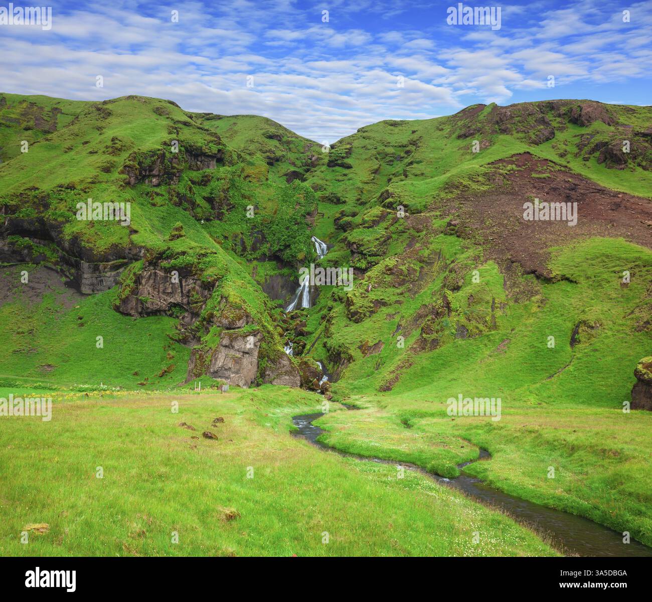 Basalt mountains covered in green moss and grass . Gorgeous cascading ...