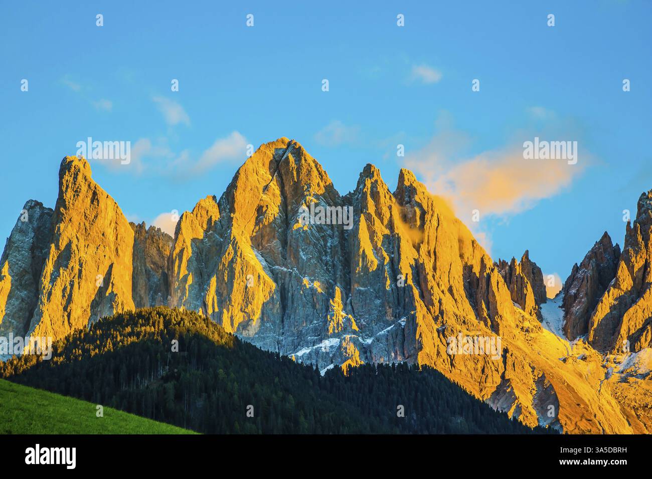 The Dolomites, Tirol. Magnificent serrated cliffs illuminate the summer ...