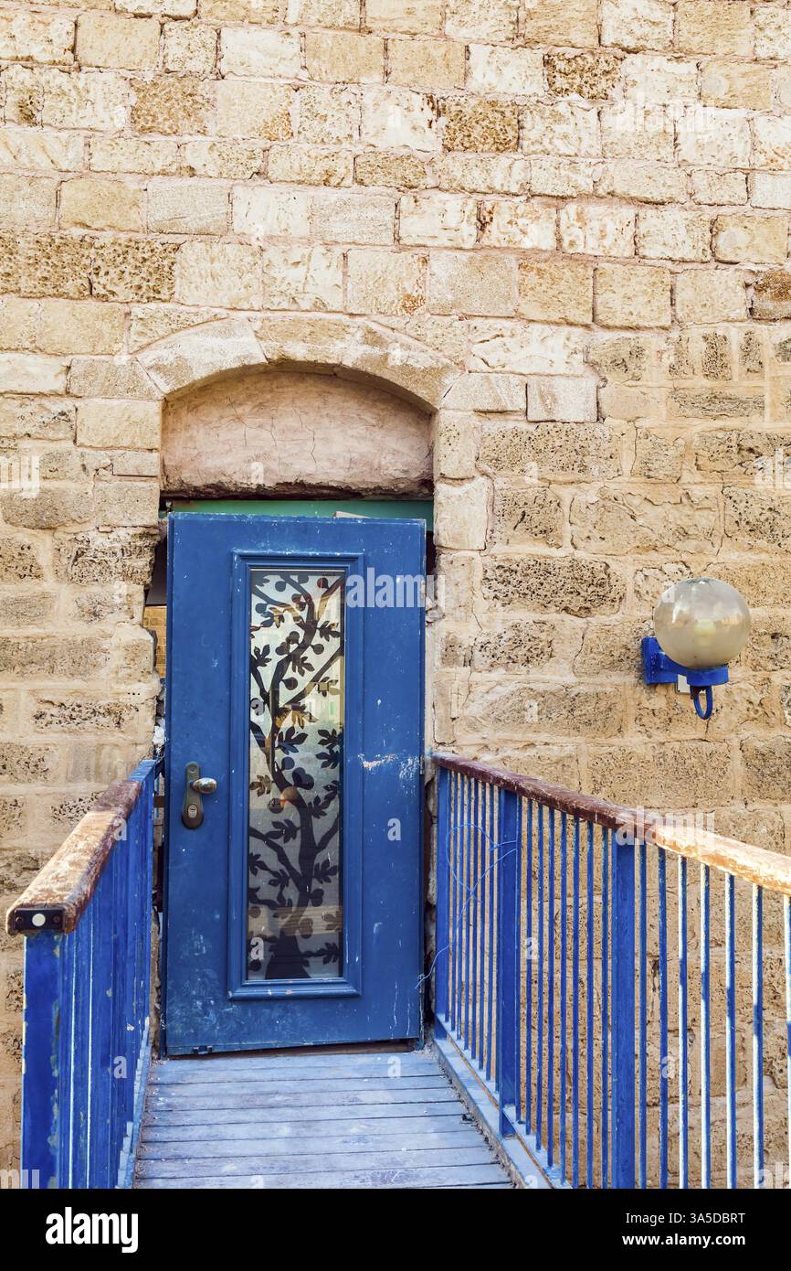 Doors bound by metal bars. Sunset. Old Yaffo - one of the most ancient ...