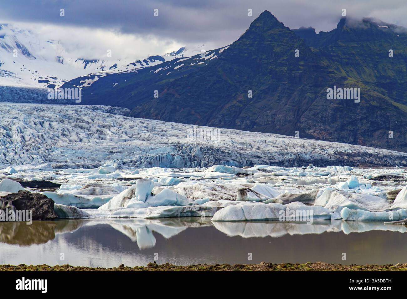 Cold summer in the Arctic. Jokulsarlon glacial lagoon. The imposing ...