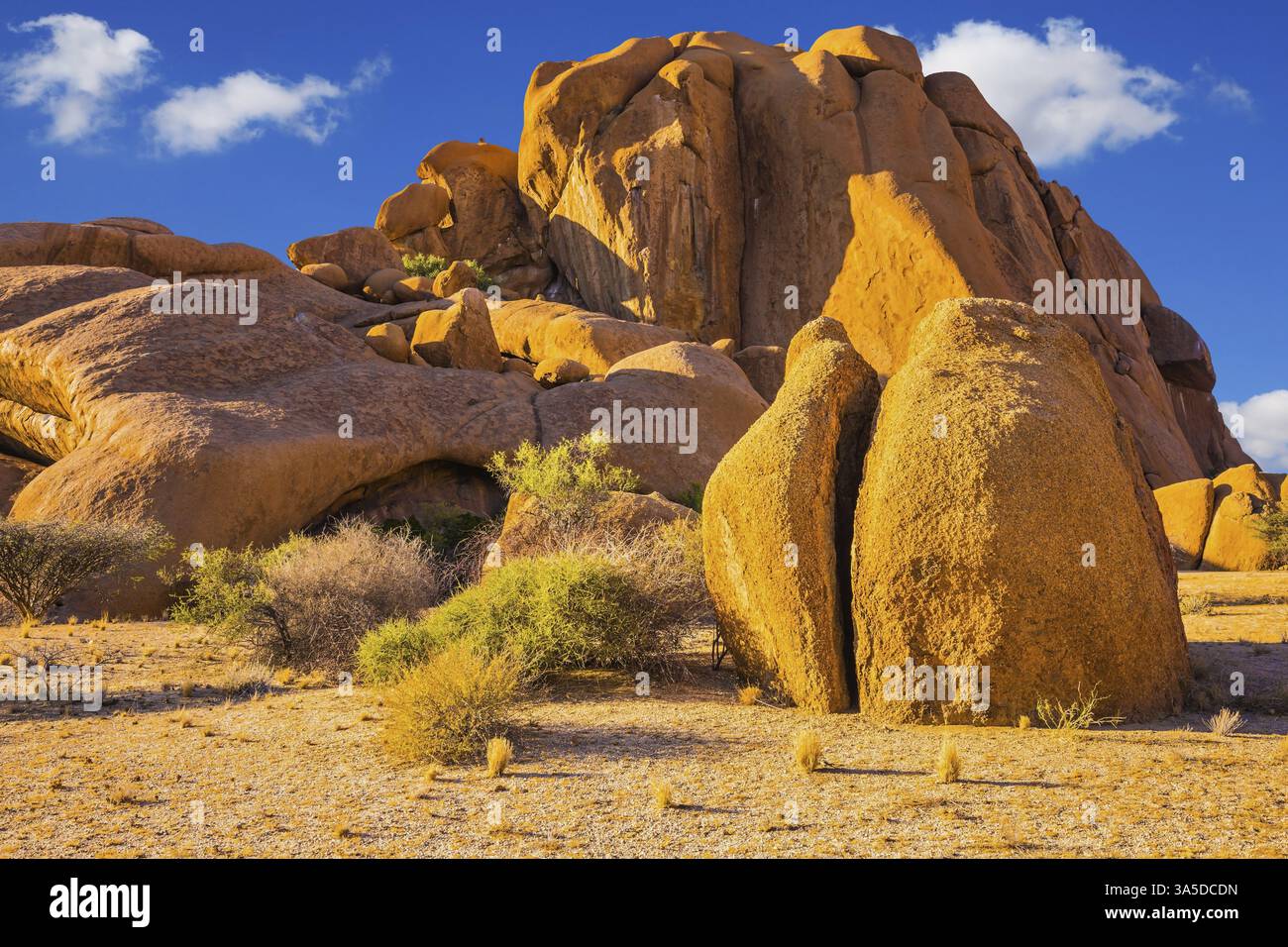 The massive granite outcrops in the Namib Desert. Play of light and ...