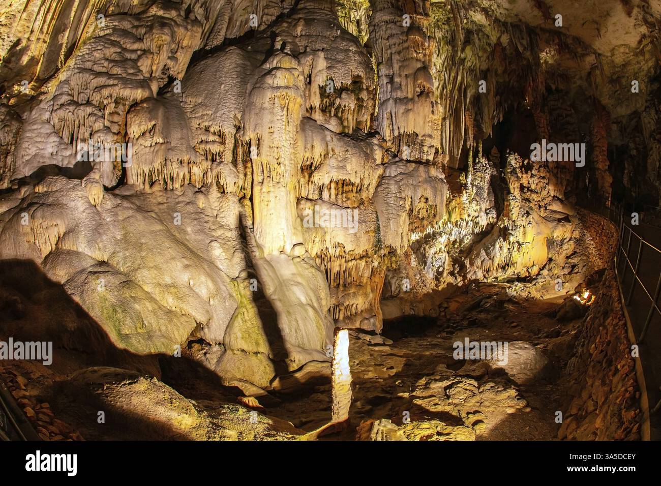 Fantastically lit underground palaces with stalactites and stalagmites ...