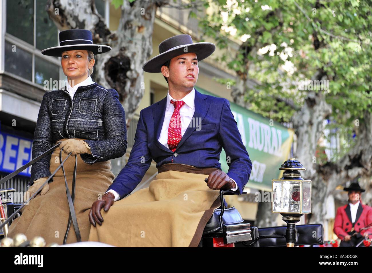 Seville, Andalusia, Spain, Europe, Two people in traditional dress on a ...