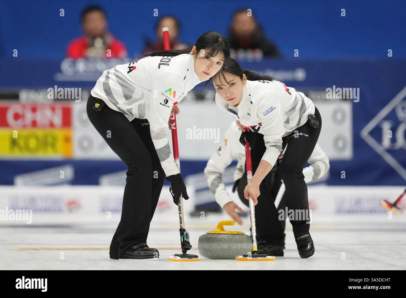 South Korea's Kim Su-ji and Seol Ye-eun sweep during the bronze medal ...