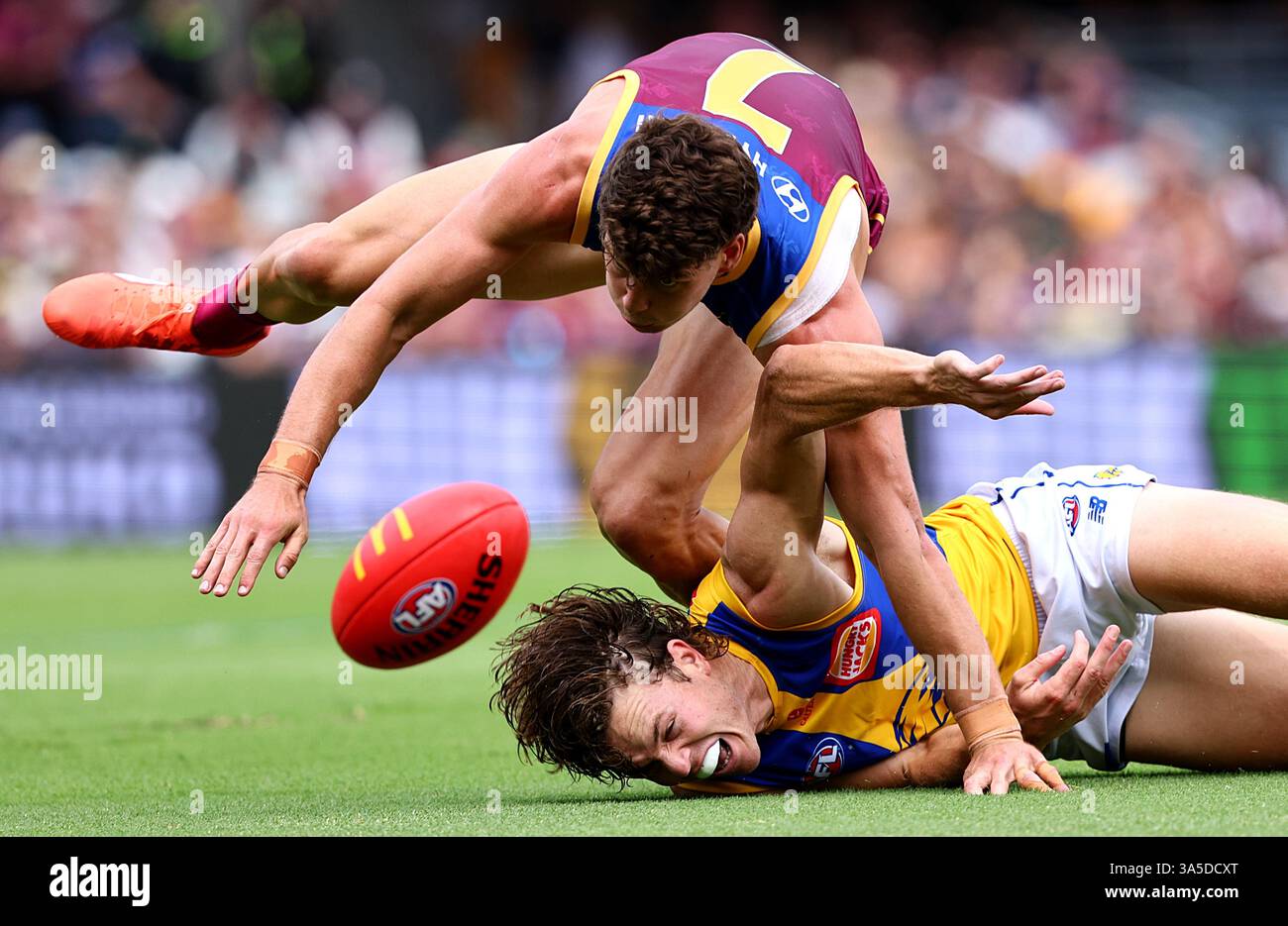 Jayden Hunt of the Eagles in action with Jarrod Berry of the Lions during the AFL Round 2 match ...