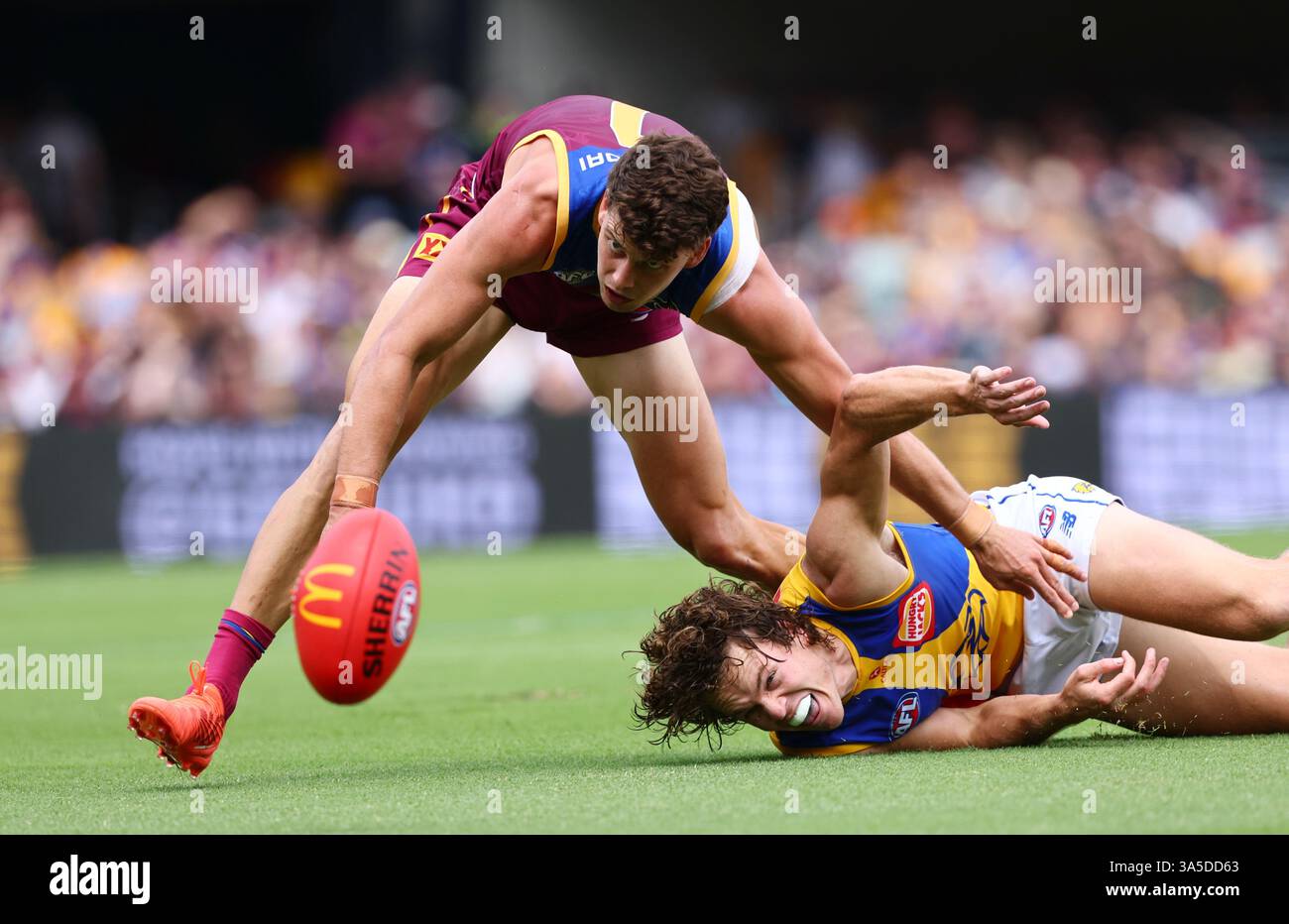 Jayden Hunt of the Eagles in action with Jarrod Berry of the Lions ...