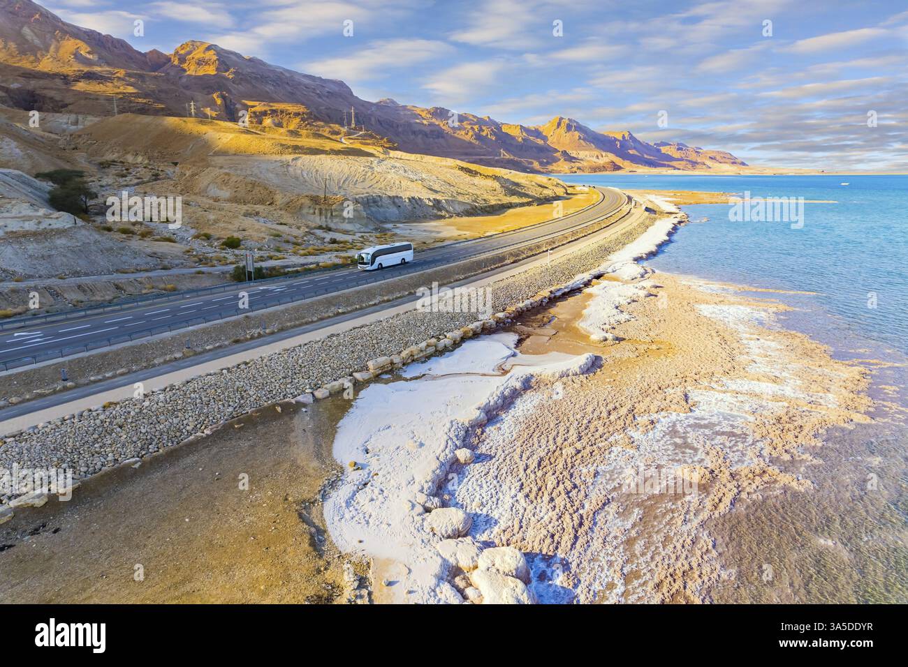 Asphalt highway runs along the seashore. Dead Sea, Israel. Shallowed ...
