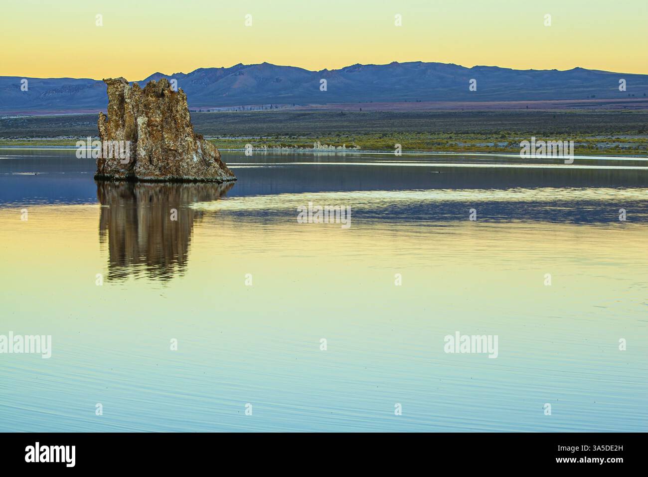 Magic reflections of tuff outliers in lake water. Lime-tuff towers of ...