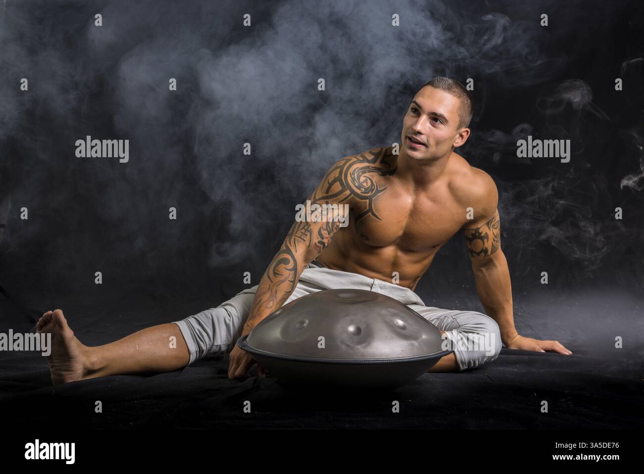 Exotic Male Drummer Drumming with Hands on Steel Pan Drums, While ...