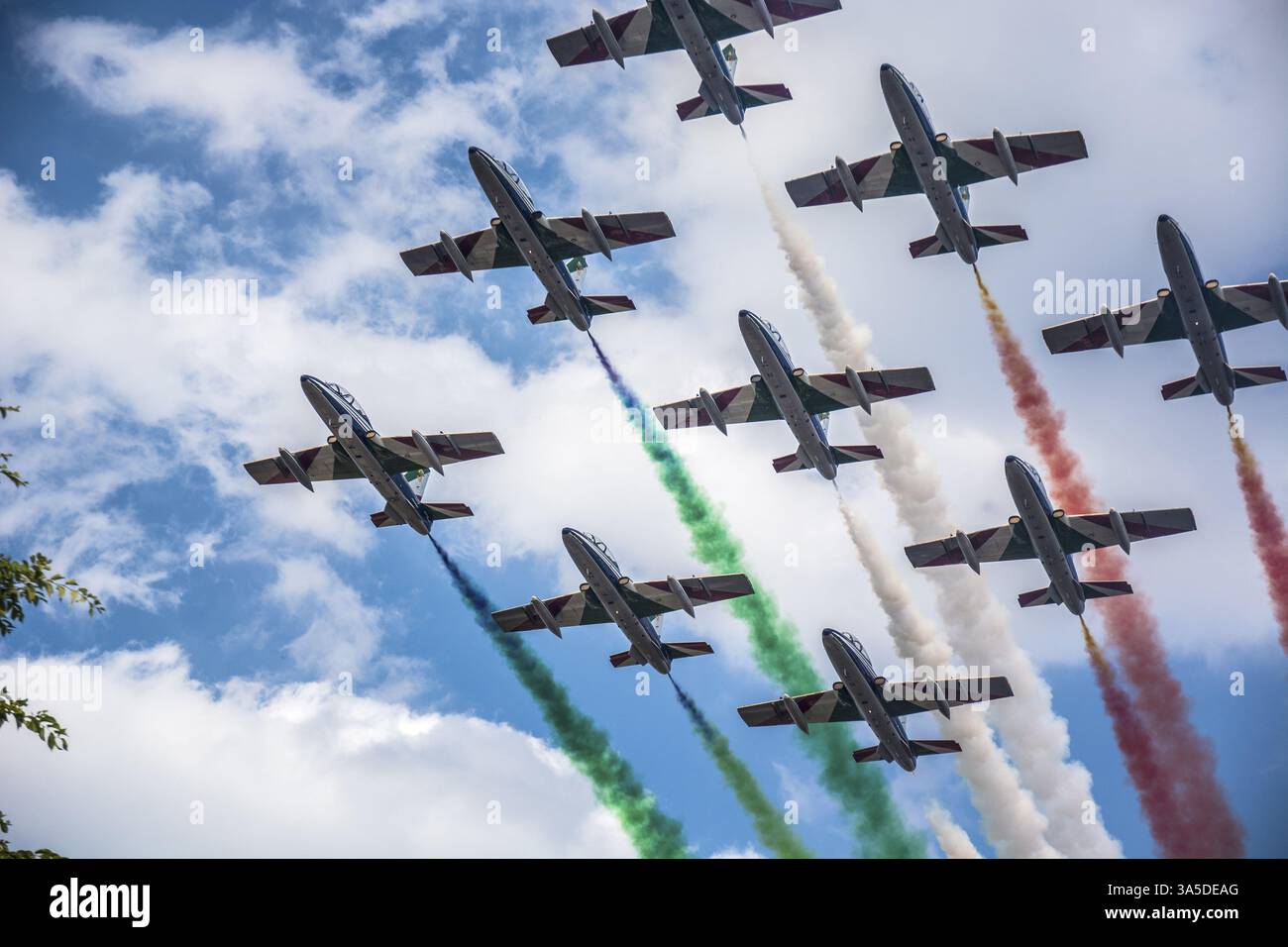 View of nine airplanes flying in the sky with red, green and white ...