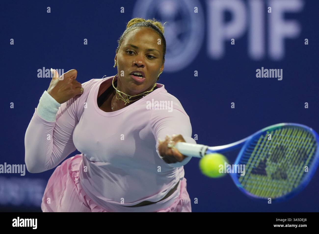Taylor Townsend hits a return to Qinwen Zheng of China during the Miami ...