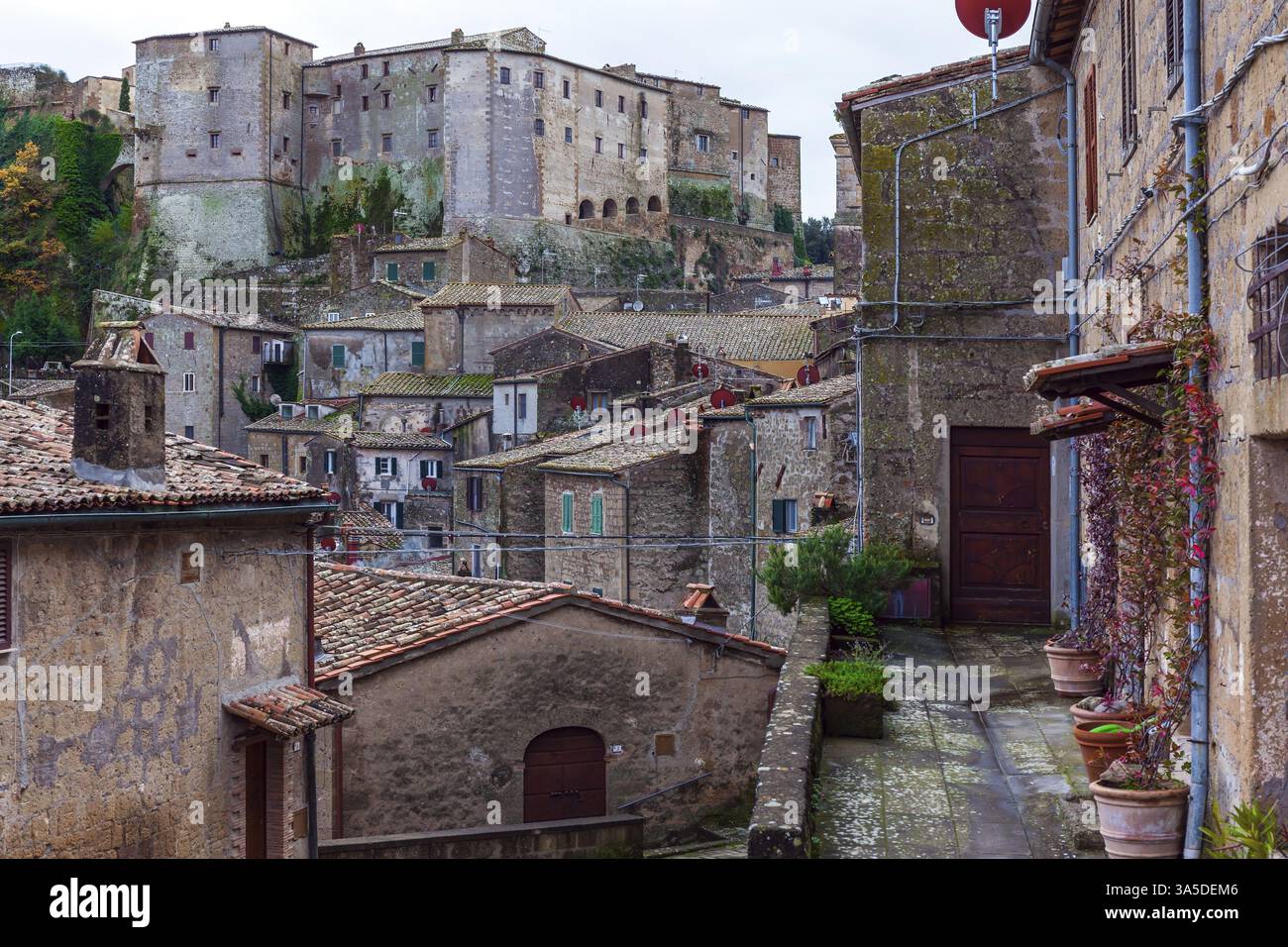 The tufa city of Sorano is enchanted city from a fairy tale. The narrow ...