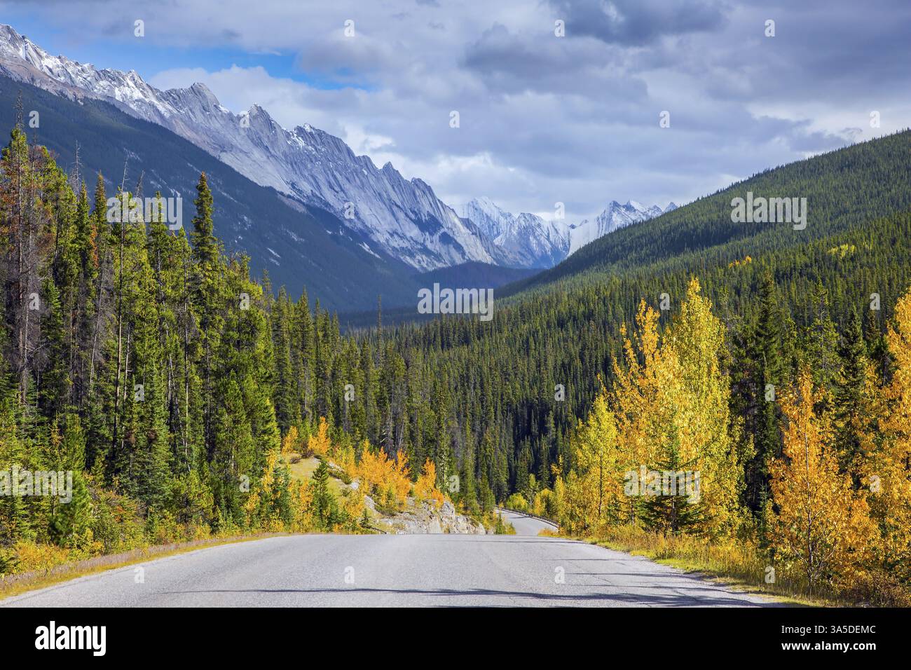 Mountain peaks are covered with snow and glaciers. The Highway 93 in ...