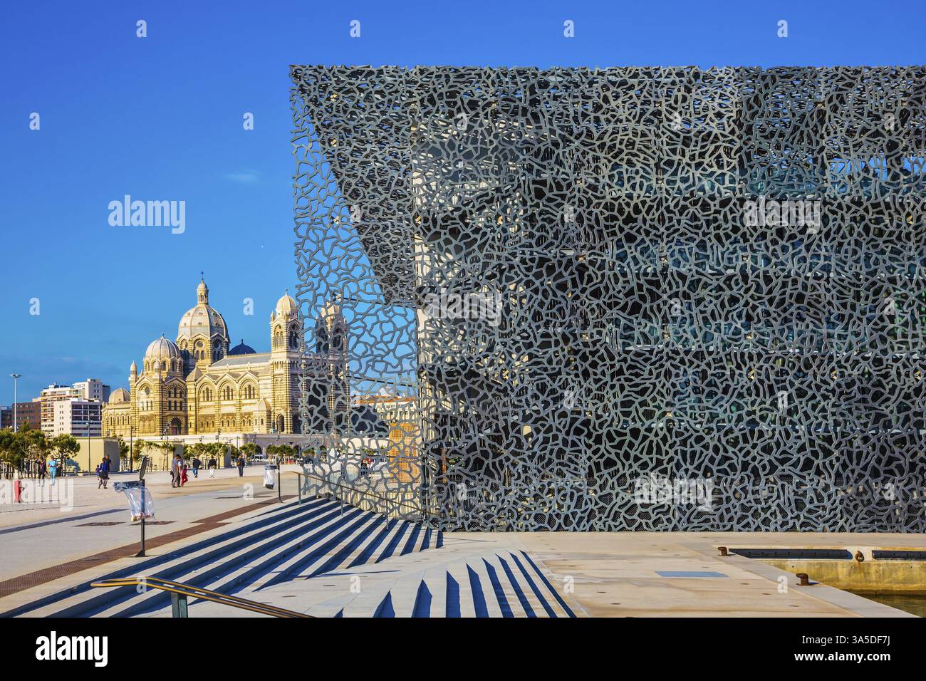The old Cathedral and a modern building on the waterfront of Marseille ...