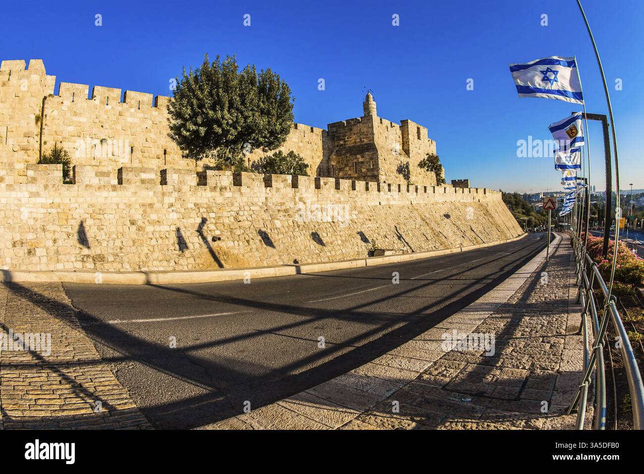 Hot summer sunset. Powerful double protective walls are illuminated by ...