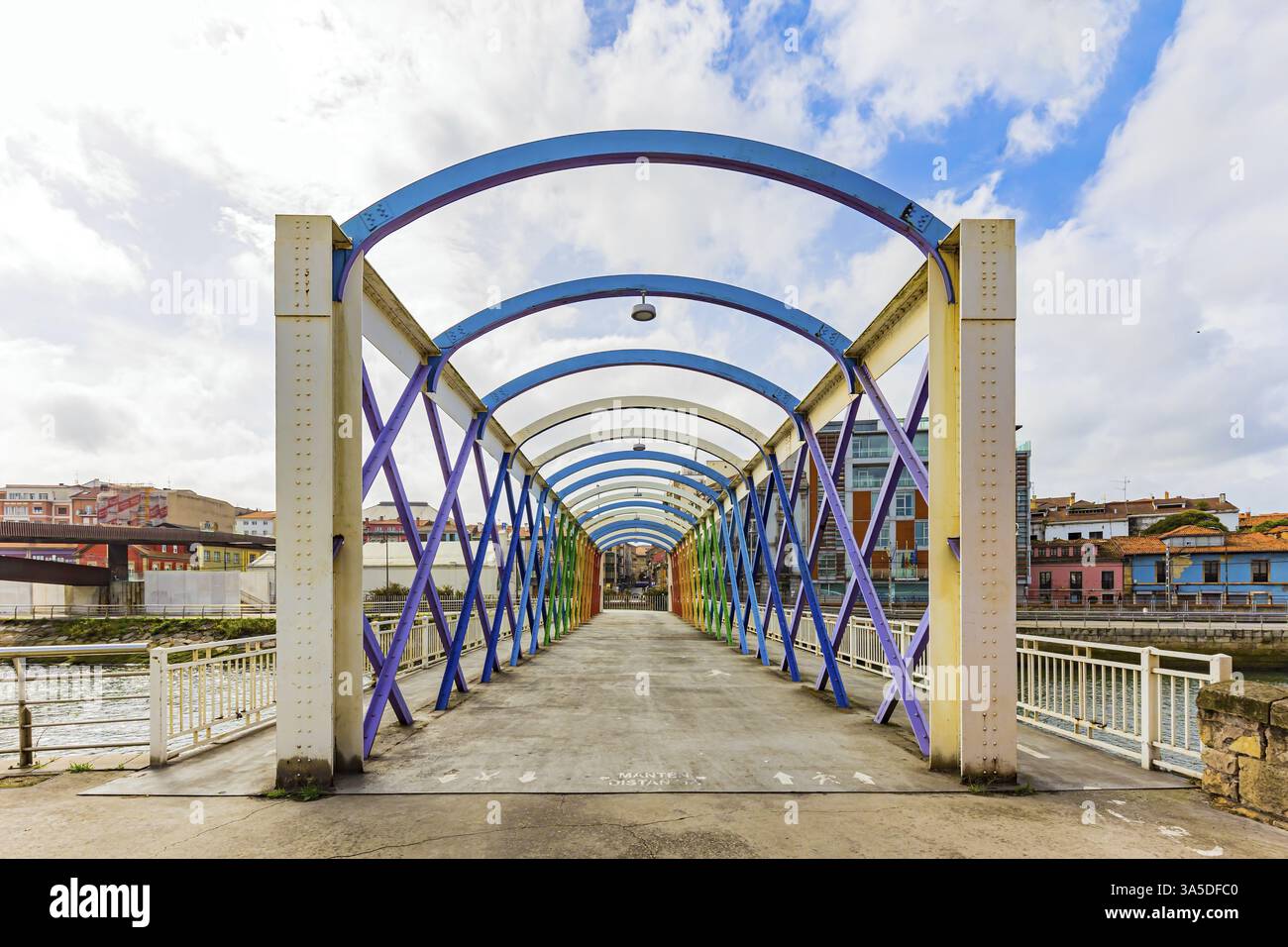 Magnificent light bridge over the river Aviles. International cultural ...