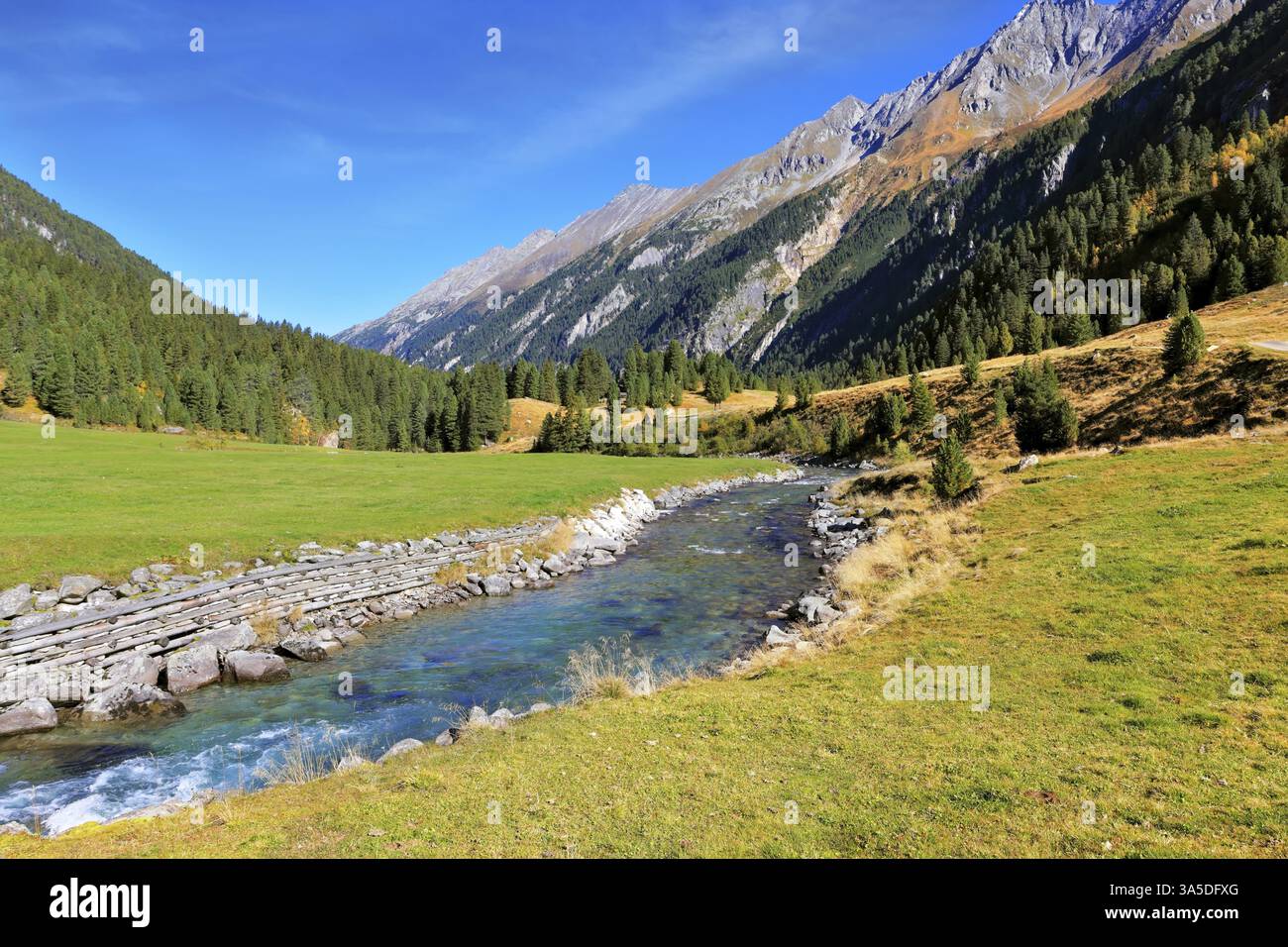 Headwaters of waterfalls - the narrow fast river among green mountain ...