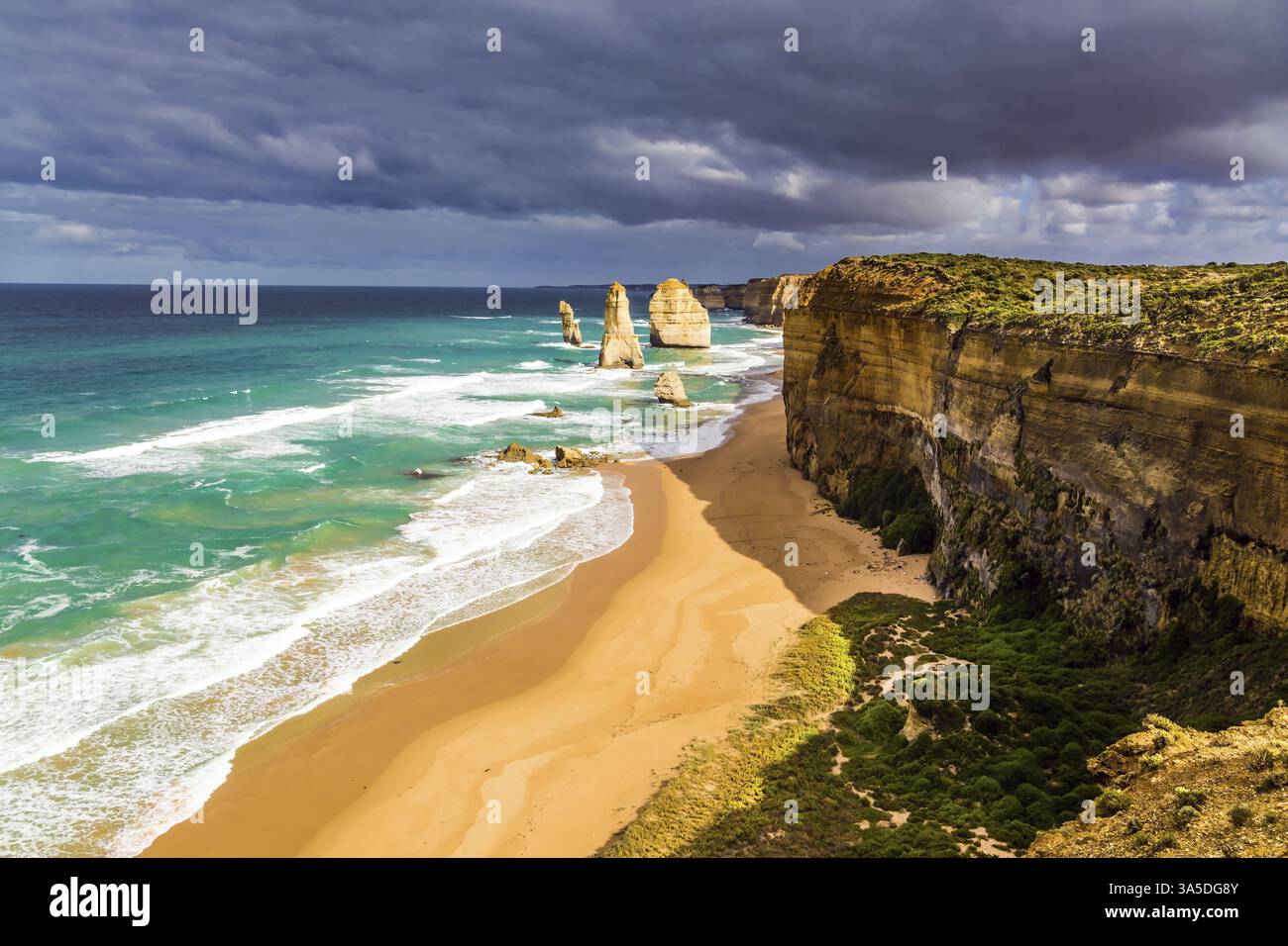 Famous rocks Twelve Apostles in ocean waves surf. Morning light on the ...
