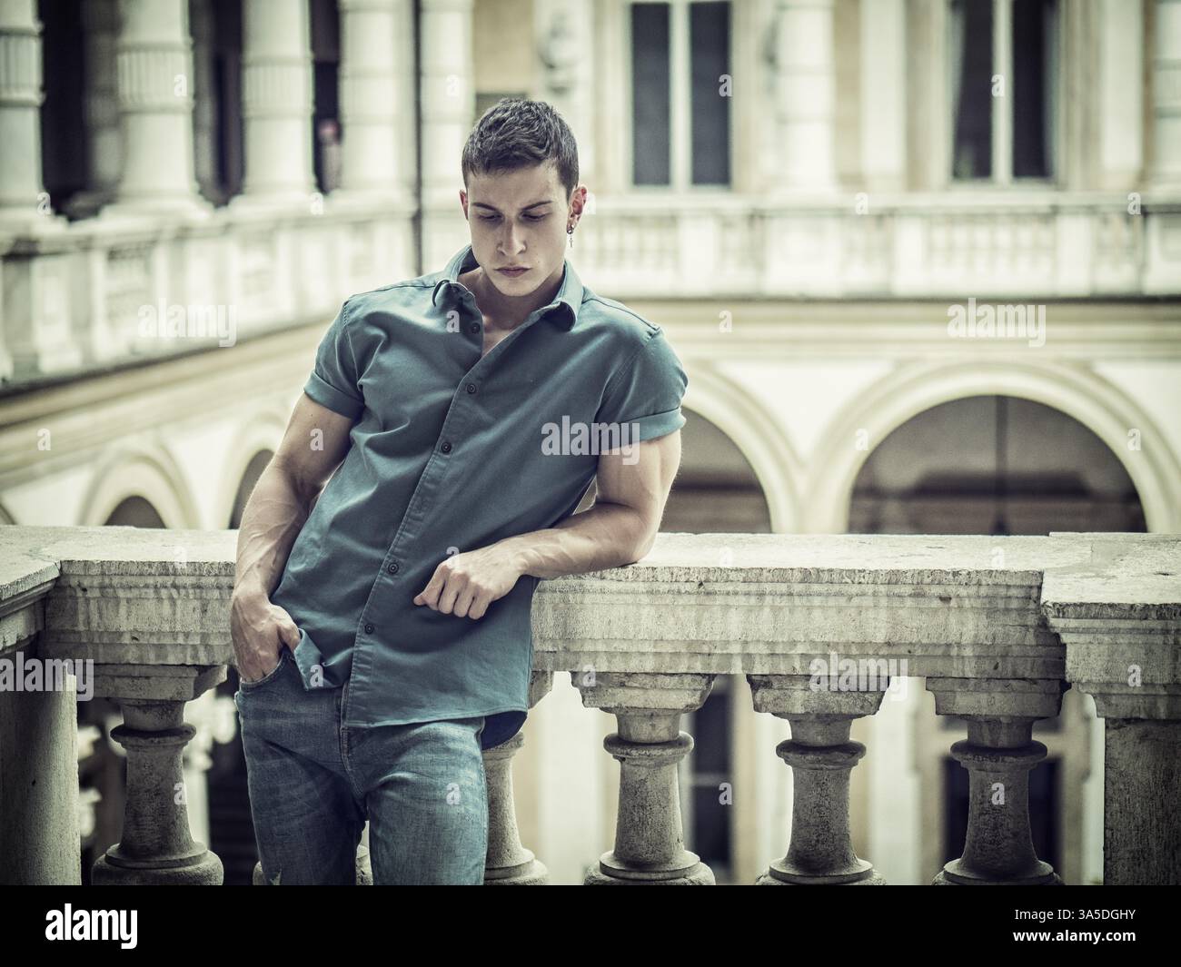Portrait of Attractive Young Man Leaning Against Polished Marble ...