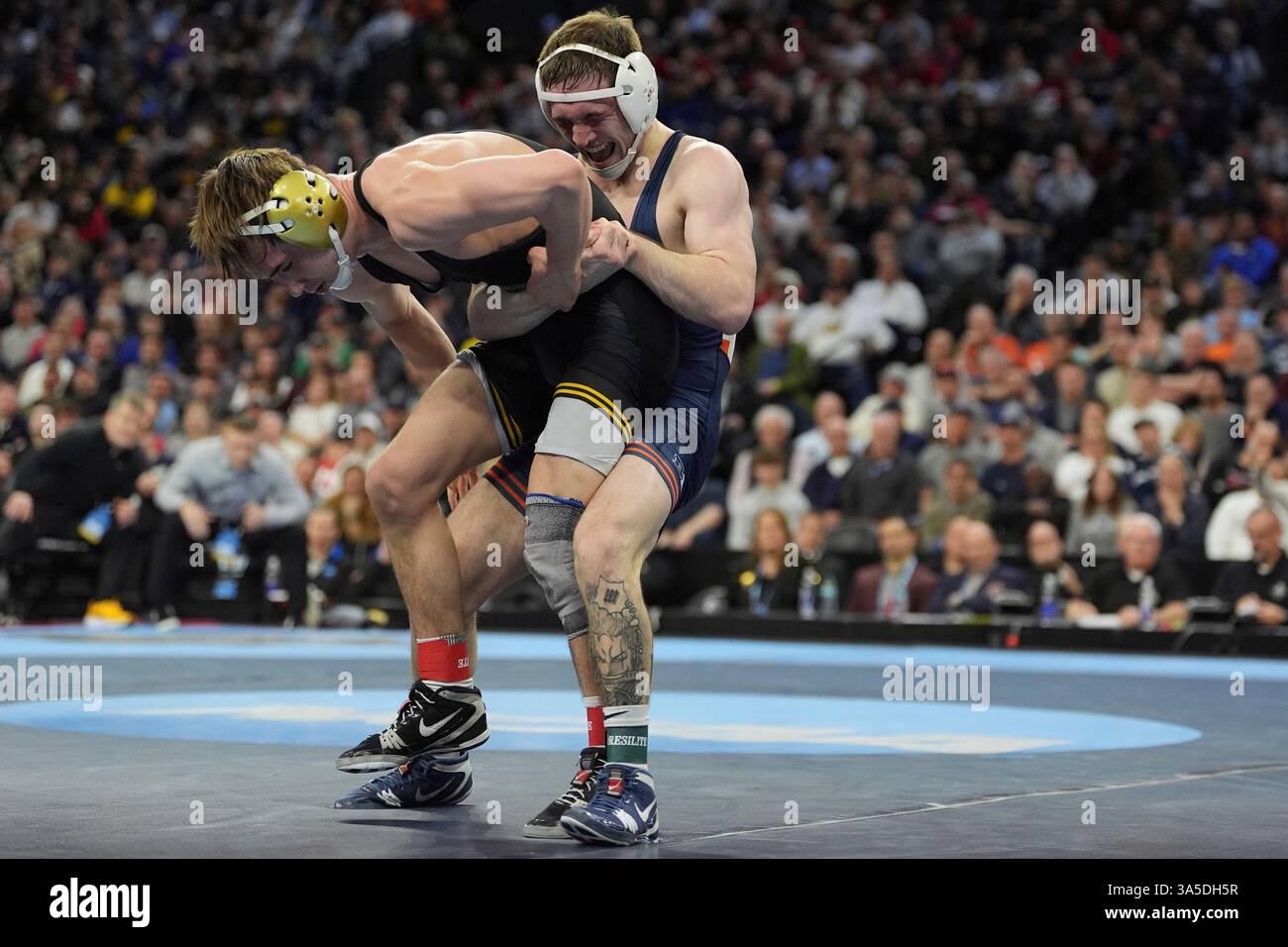 Illinois' Lucas Byrd, right, takes on Iowa's Drake Ayala in their 133 ...