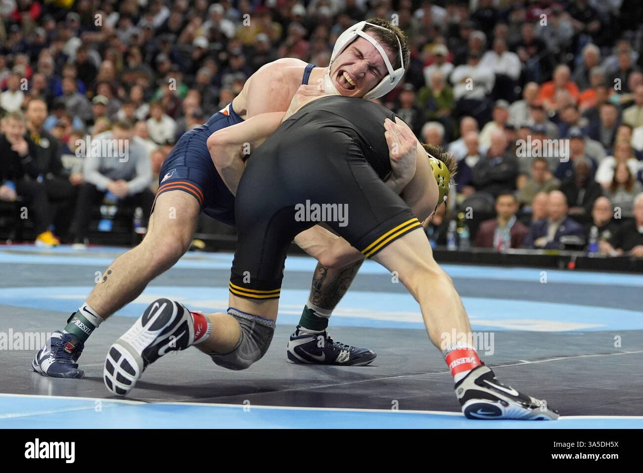 Illinois' Lucas Byrd, top, takes on Iowa's Drake Ayala in their 133 ...