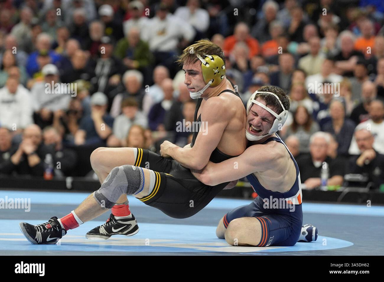 Illinois' Lucas Byrd, right, takes on Iowa's Drake Ayala in their 133 ...