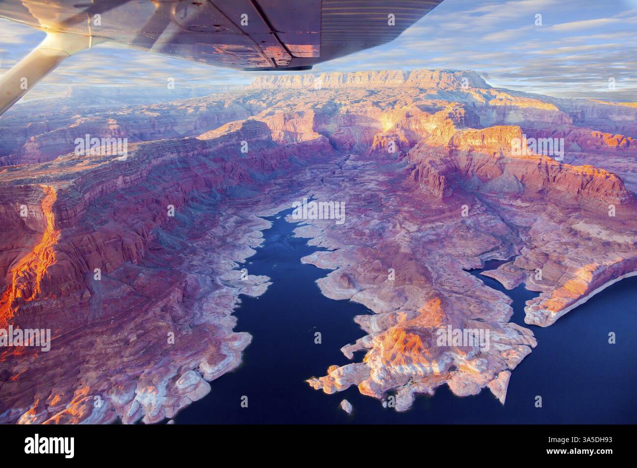 Landscape under the wing of an airplane. U.S. The coast of Lake Powell ...
