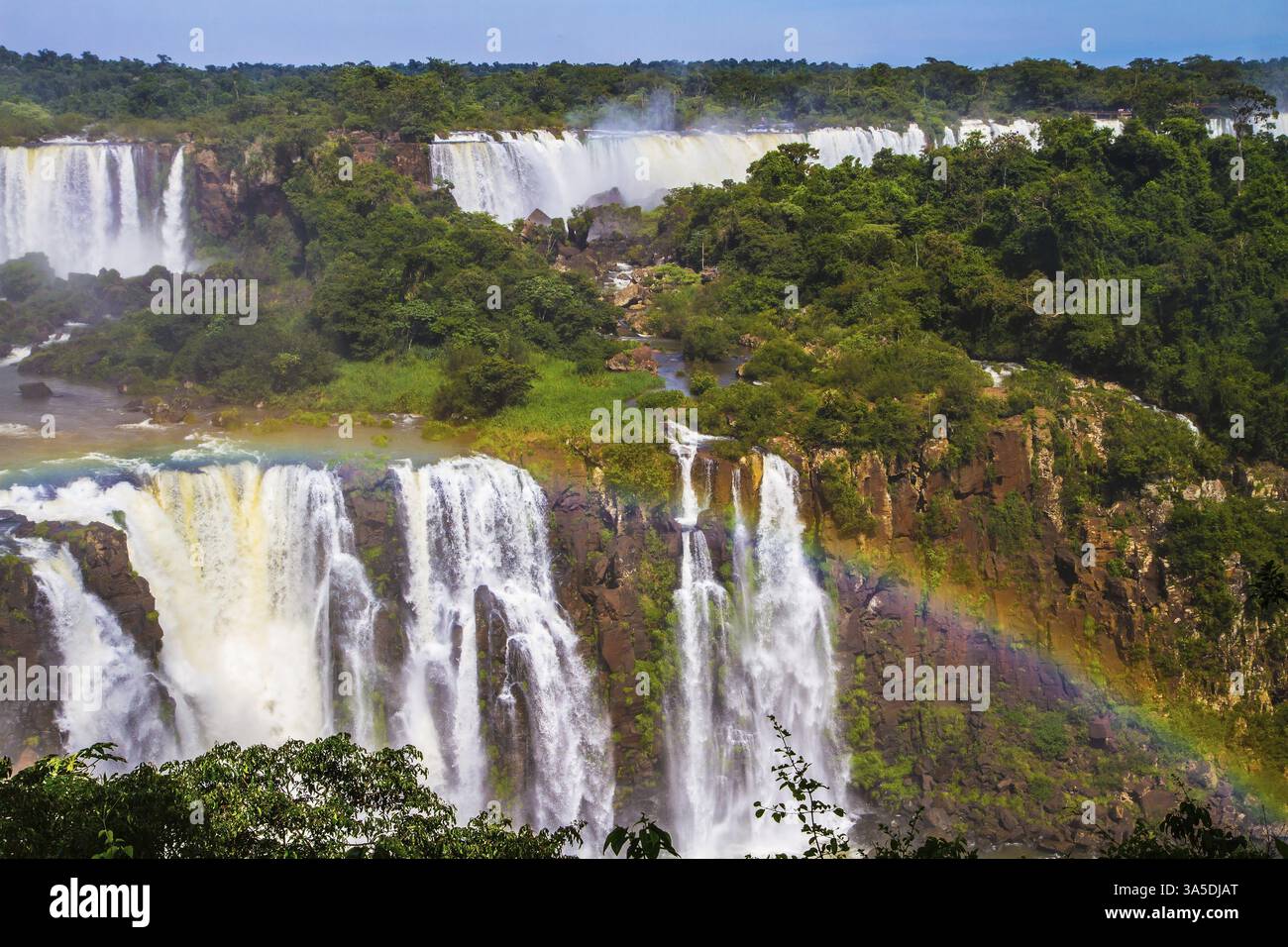Multistage system of waterfalls creates rainbow. Iguazu Falls National ...