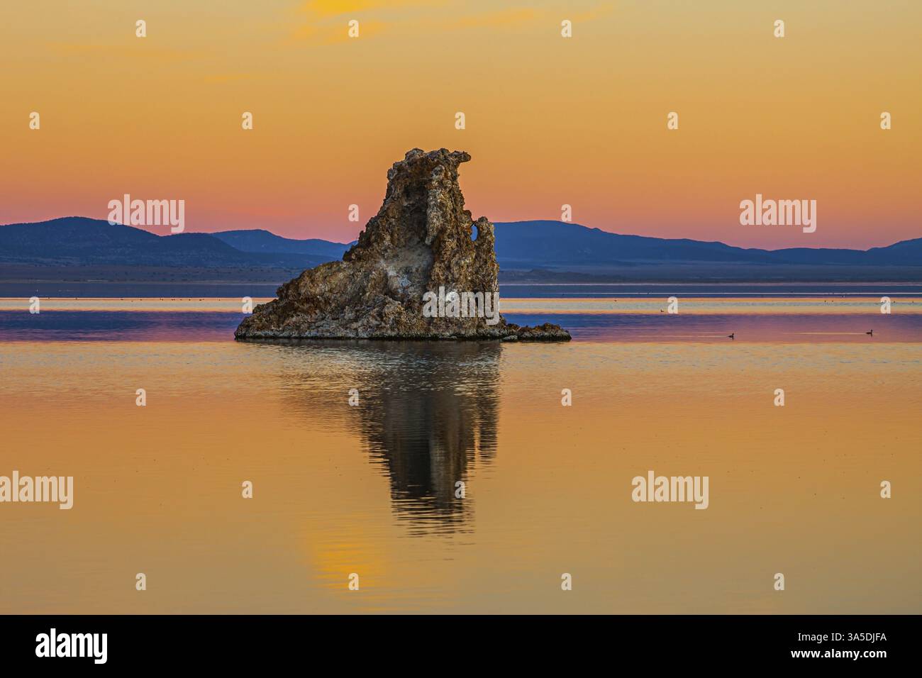 Magic sunset on the lake. Lime-tuff towers of bizarre shapes rise from ...