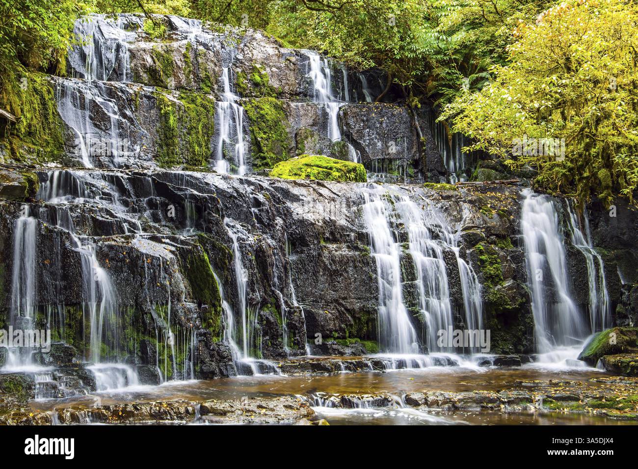 South Island, New Zealand. Picturesque multi-tiered cascading ...