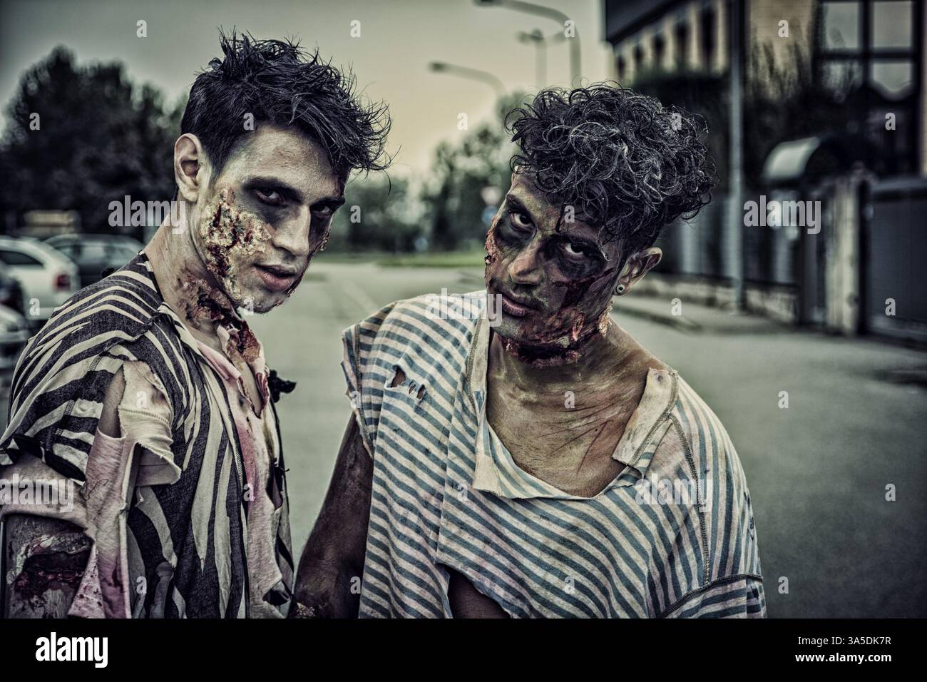 Two male zombies standing in empty city street looking at camera Stock ...
