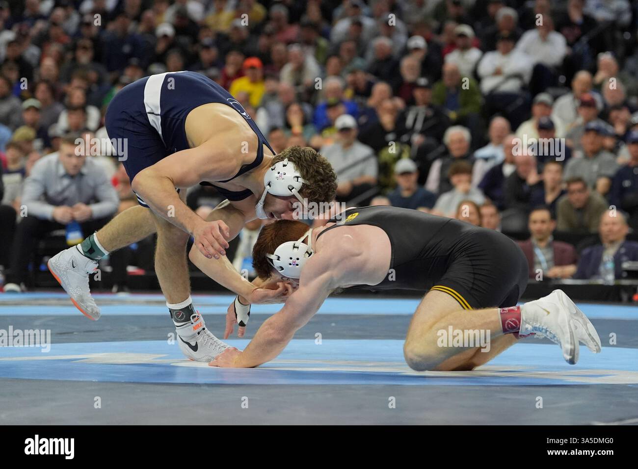 Penn State's Mitchell Mesenbrink, left, takes on Iowa's Mike Caliendo ...