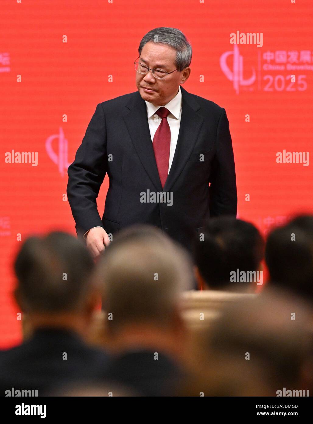 China's Premier Li Qiang walks after delivering speech during an ...
