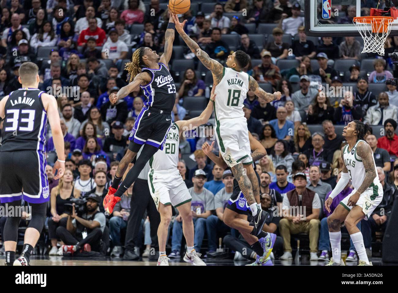 Sacramento Kings guard Keon Ellis (23) jumps to grab the rebound from ...