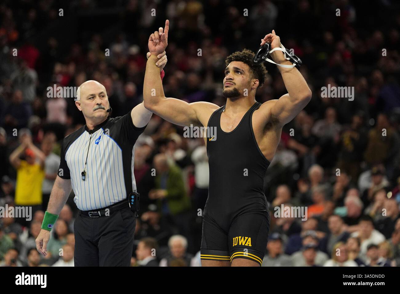 Iowa's Stephen Buchanan, celebrates after defeating Penn State's Josh ...